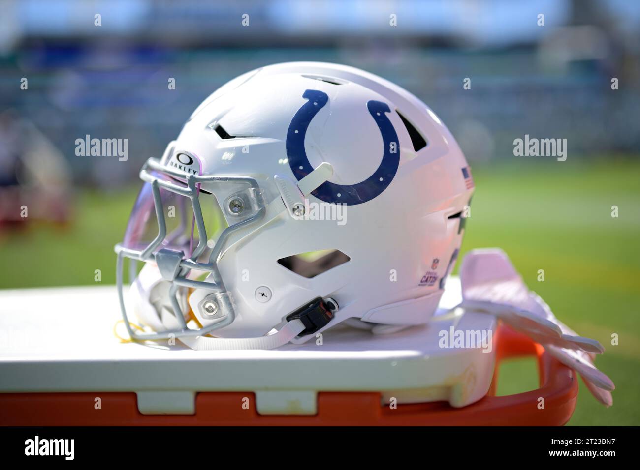 An Indianapolis Colts helmet is viewed on a cooler along the sideline ...