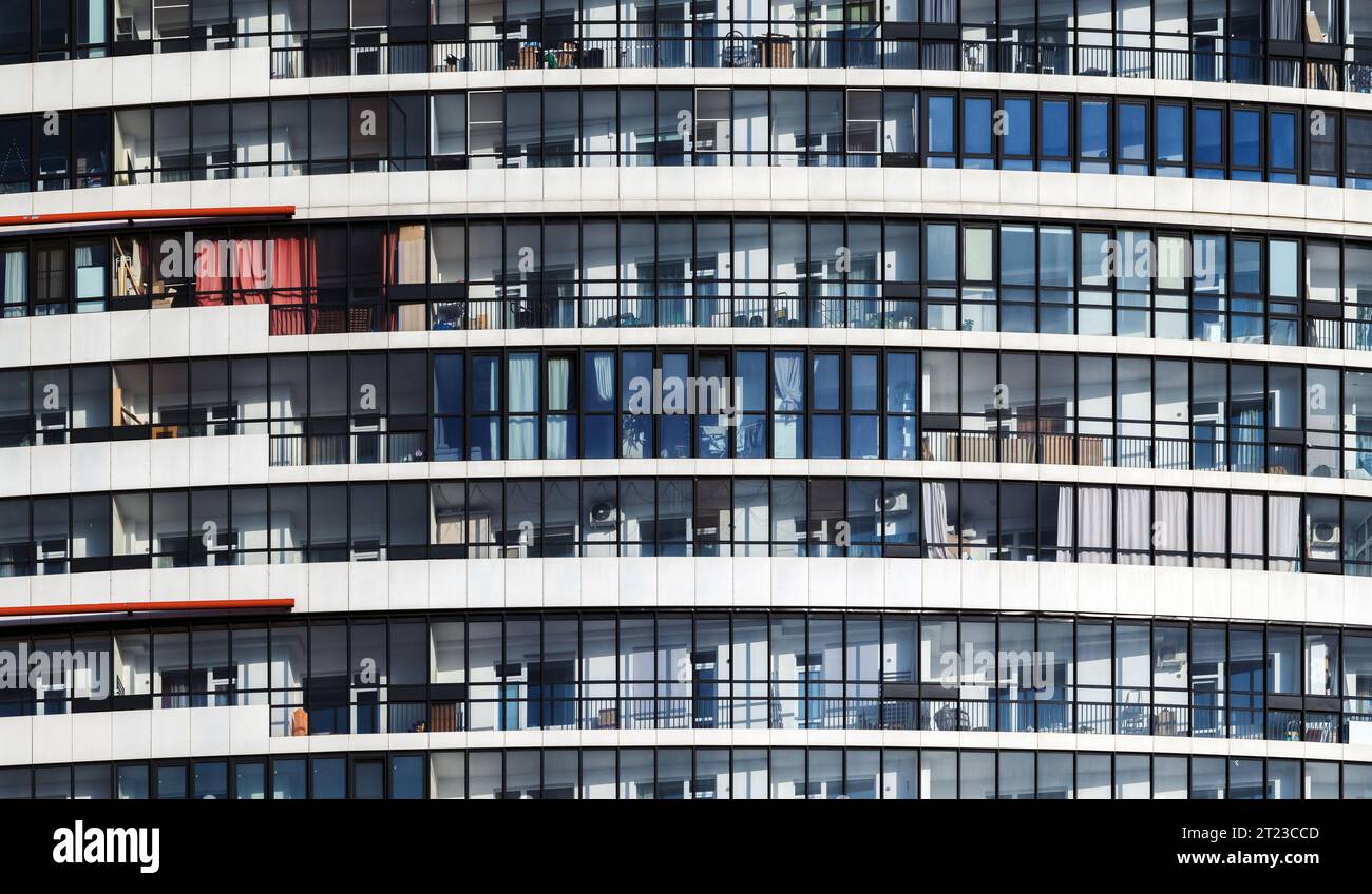 White round house facade with glazed balconies. Abstract modern ...