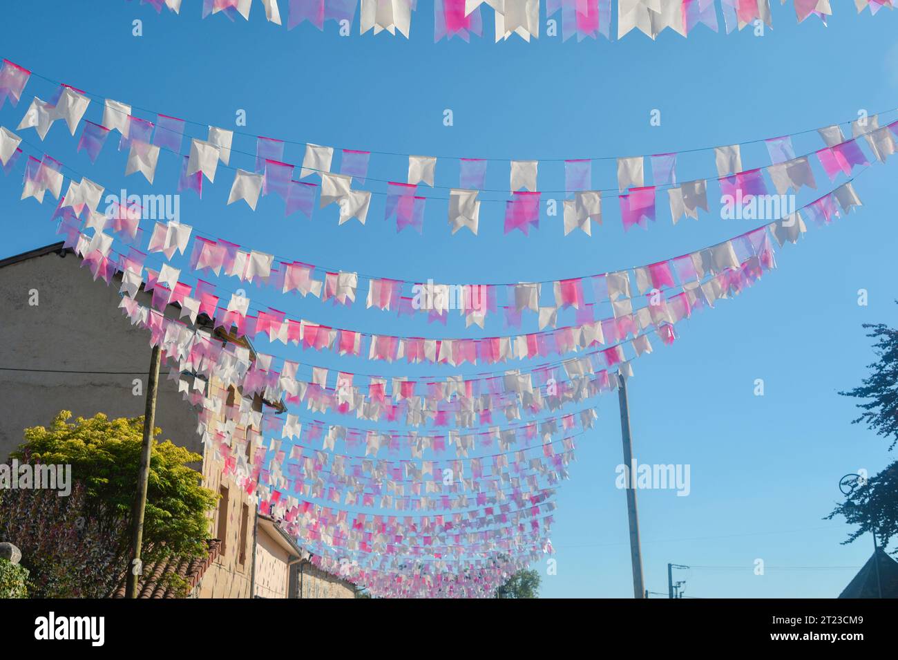 small flags stretched on a rope on a sky background Stock Photo - Alamy