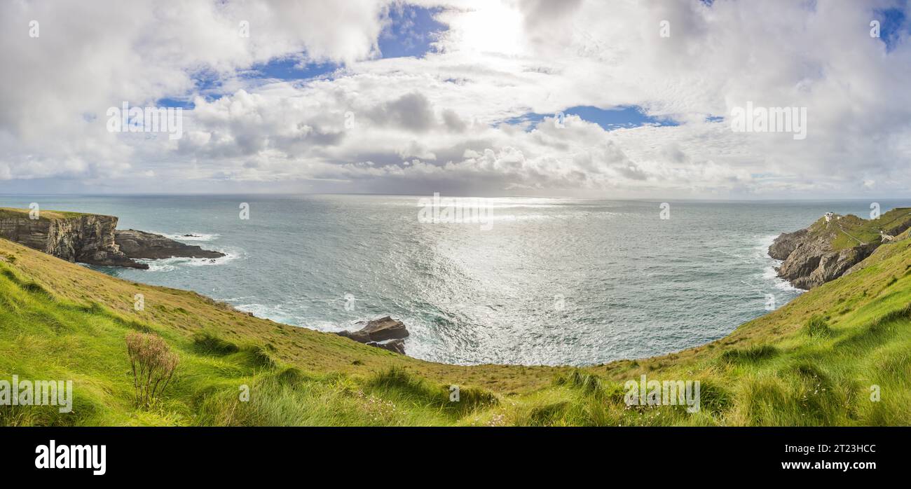 Panorama picture of typical Irish coast line with green meadows and ...