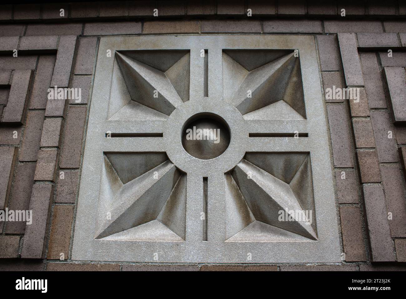 An ornate stone carving is featured on the exterior of an elegant ...