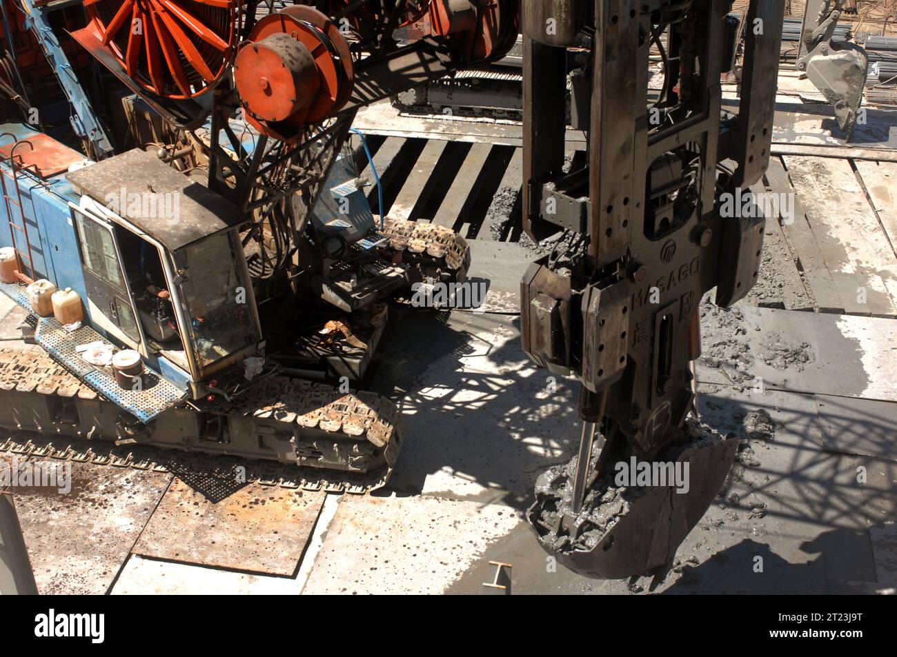 Digger working in a building site during construction of a new office ...