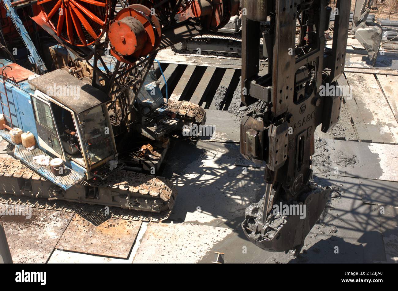 Digger working in a building site during construction of a new office ...