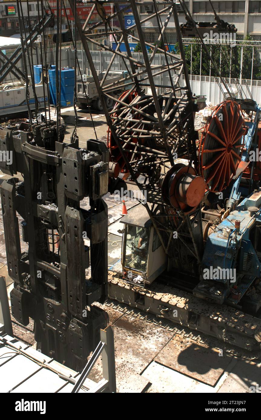 Digger working in a building site during construction of a new office ...