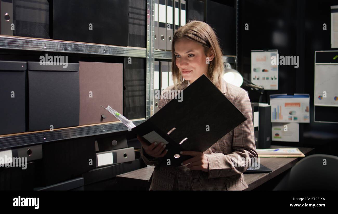 Female private investigator conducting investigation in office ...