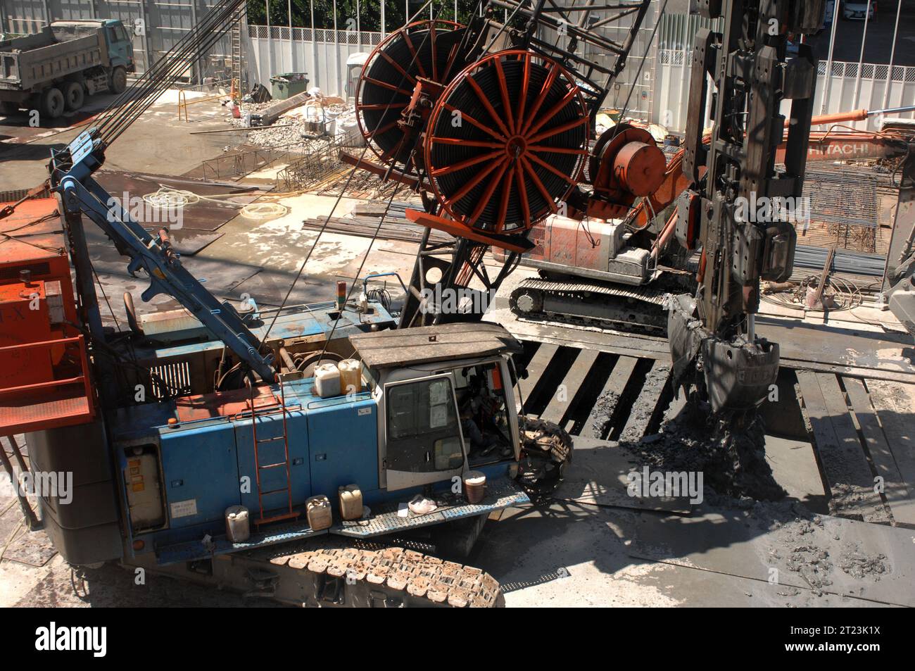 Digger working in a building site during construction of a new office ...