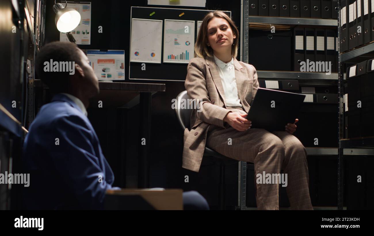 African American detective and caucasian officer work together in ...