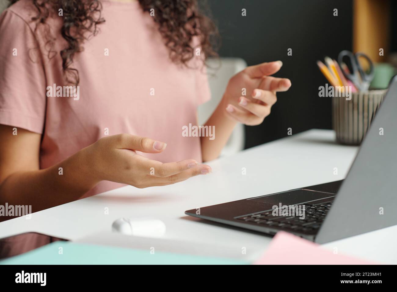 Focus on hands of clever learner pf secondary school explaining ...