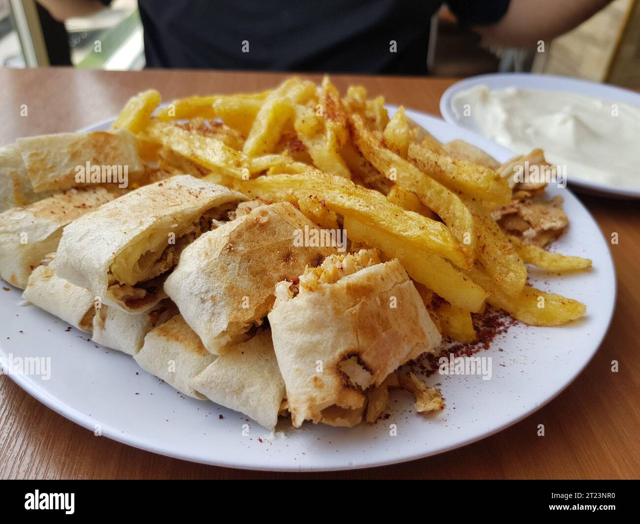 Shawarma dish served on wooden table with close up and top view also ...