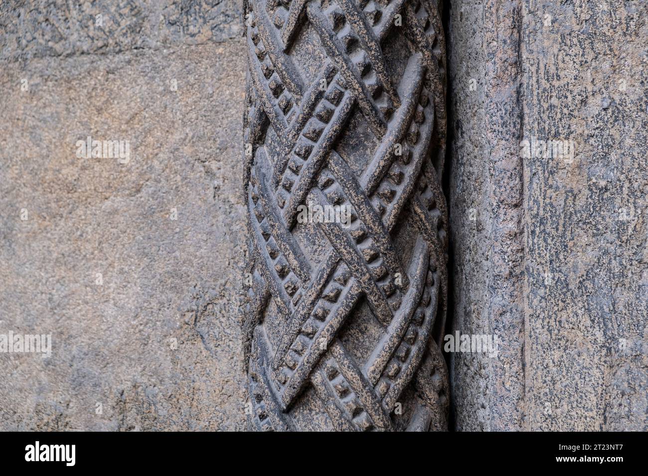 Decorated Old aged weathered stone wall Facade of historical building ...