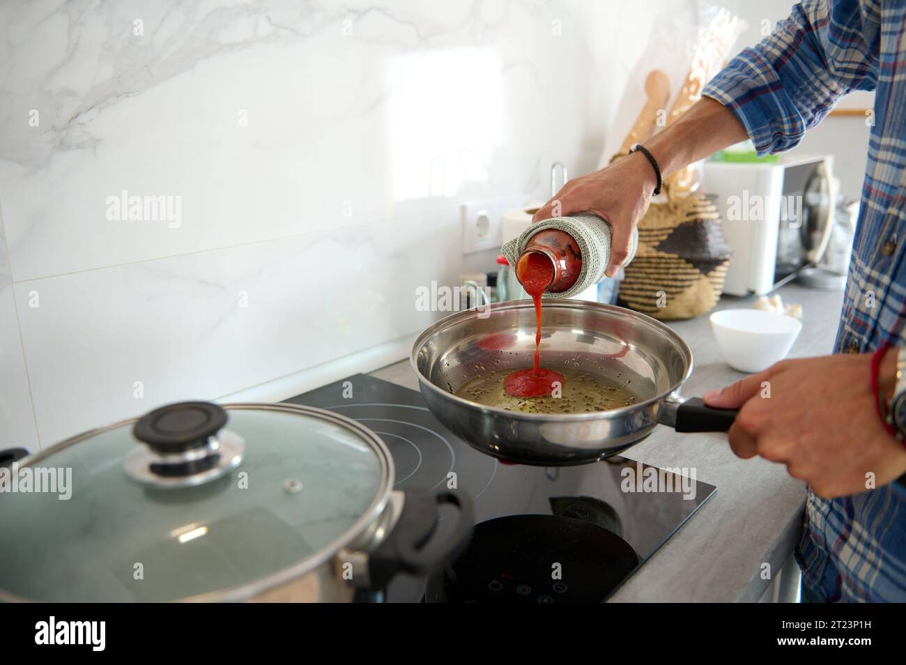 Adding oil pan cooking pasta hi-res stock photography and images - Alamy