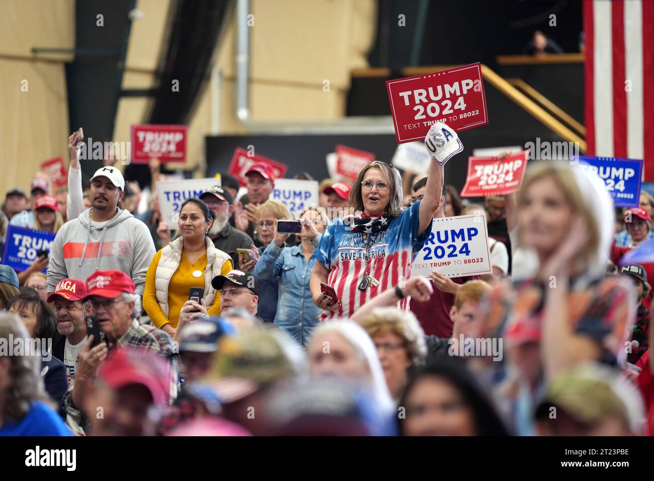 Audience members cheer for former President Donald Trump during a ...