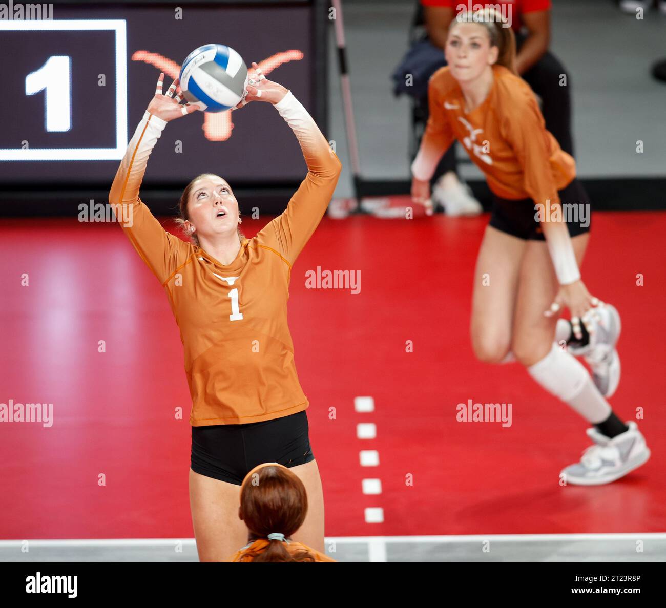 October 14, 2023: Texas setter Ella Swindle (1) sets the ball as ...