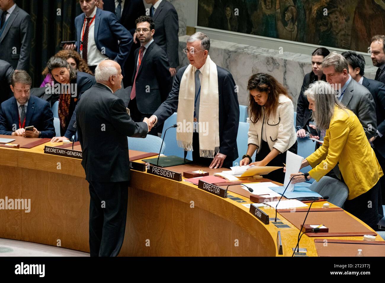 Palestinian Observer to the United Nations, Riyad Mansour, left, faces and shakes hands with ...