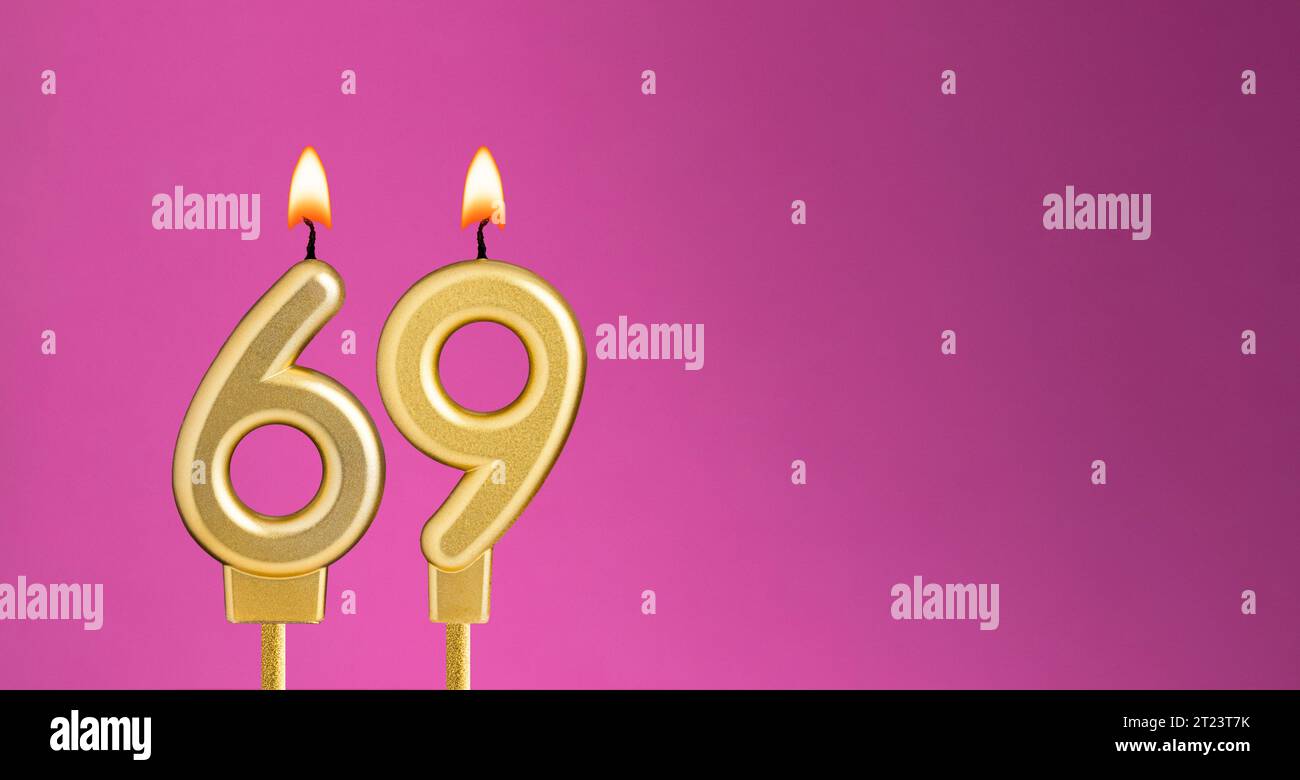 Candle number 69 in purple background - birthday card Stock Photo - Alamy