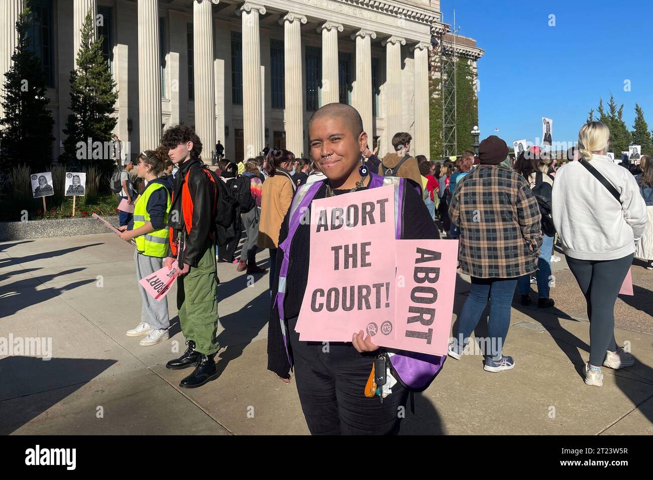 EDS NOTE: OBSCENITY - Alessia Huaman holds pink signs, Monday, Oct. 16 ...