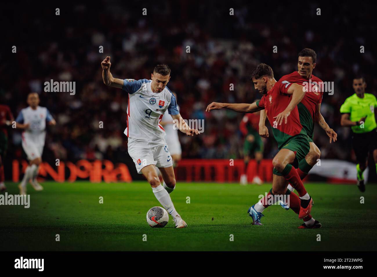 Robert Bozenik, Ruben Dias during UEFA Euro 2024 qualifying game ...