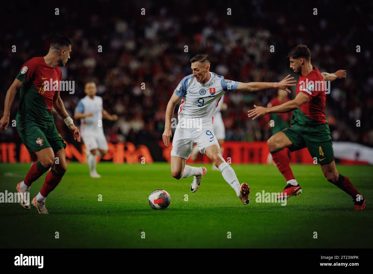 Robert Bozenik, Ruben Dias during UEFA Euro 2024 qualifying game ...