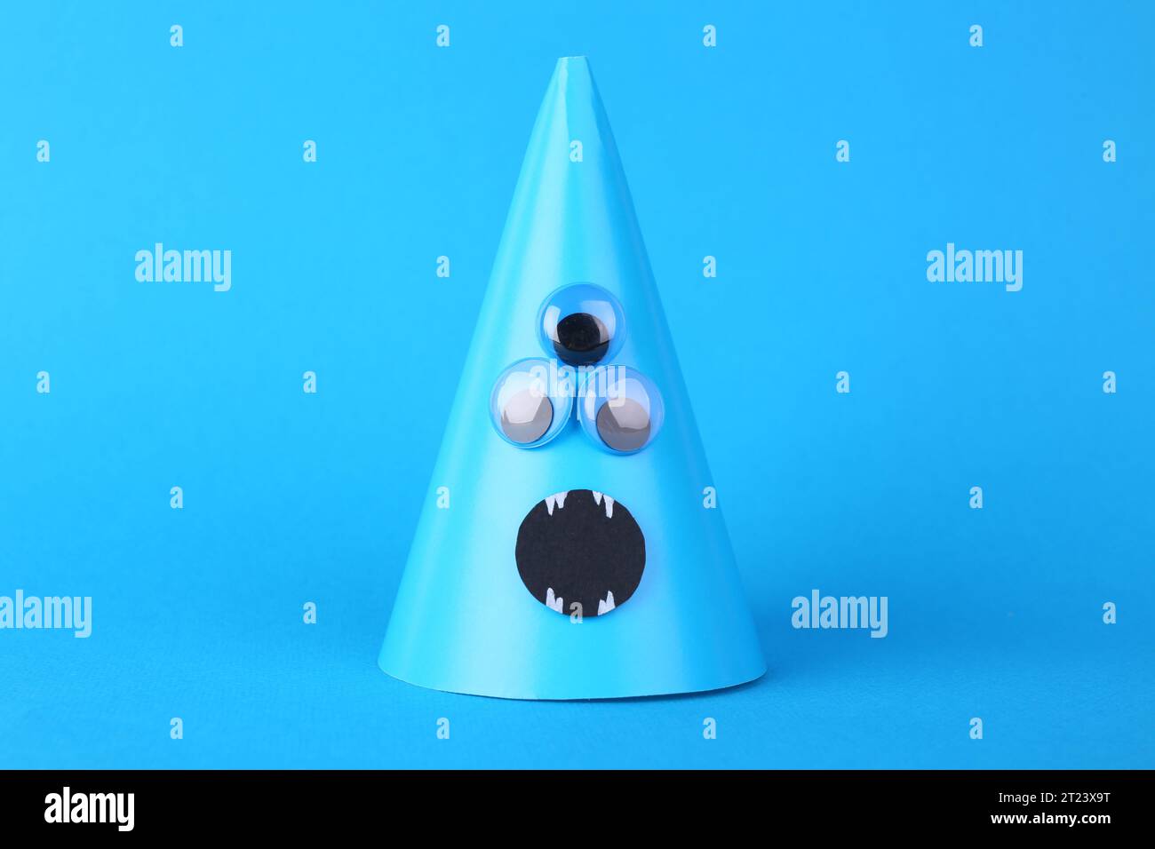 Spooky paper monster on light blue background. Handmade Halloween ...