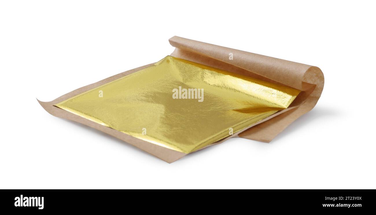 One edible gold leaf sheet isolated on white Stock Photo - Alamy