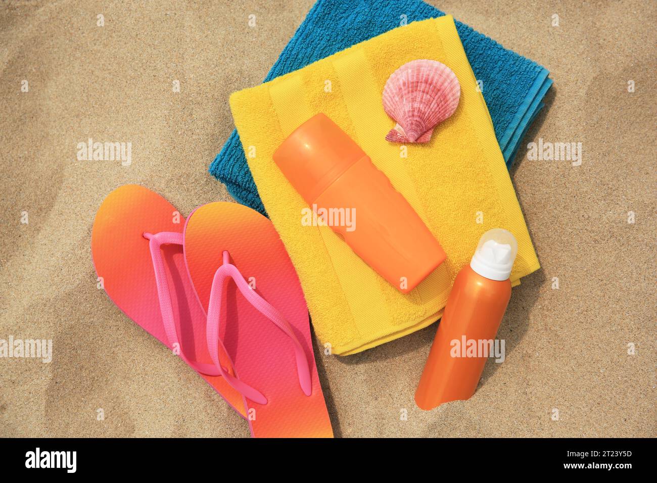Flat lay composition with sunscreens on sand. Sun protection care Stock ...