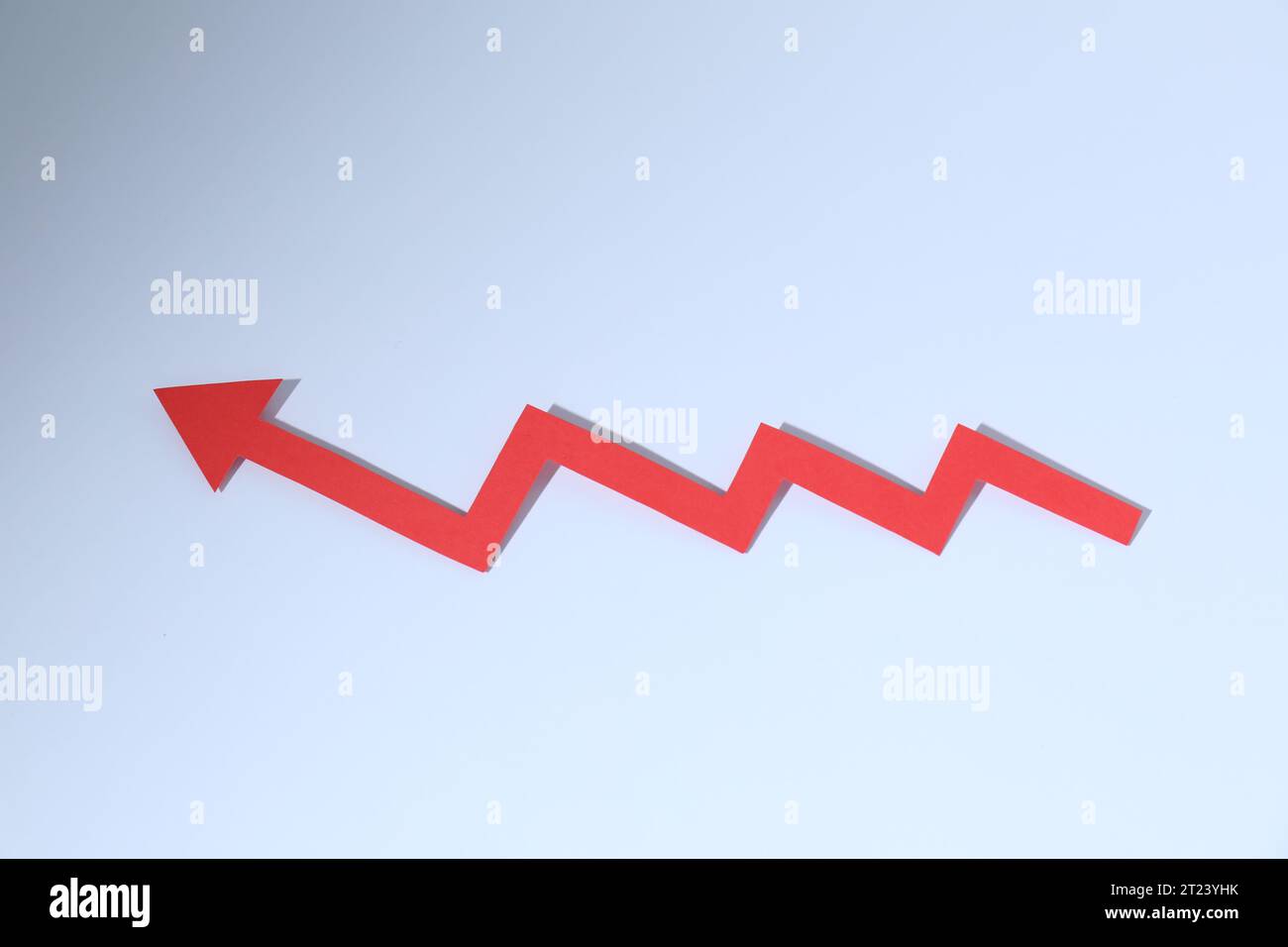 Red zigzag paper arrow on white background, top view Stock Photo - Alamy