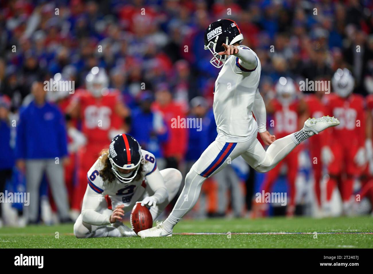 New York Giants kicker Graham Gano, right, kicks a field goal from the ...