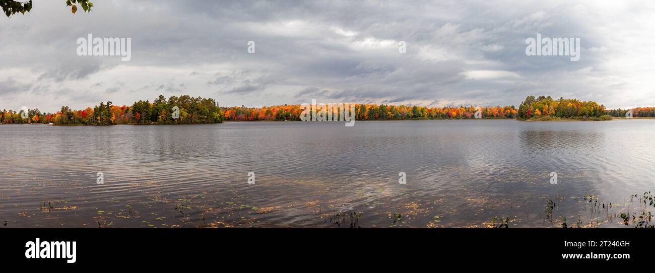 Colorful autumn trees on lake of the Falls in Mercer, Wisconsin ...
