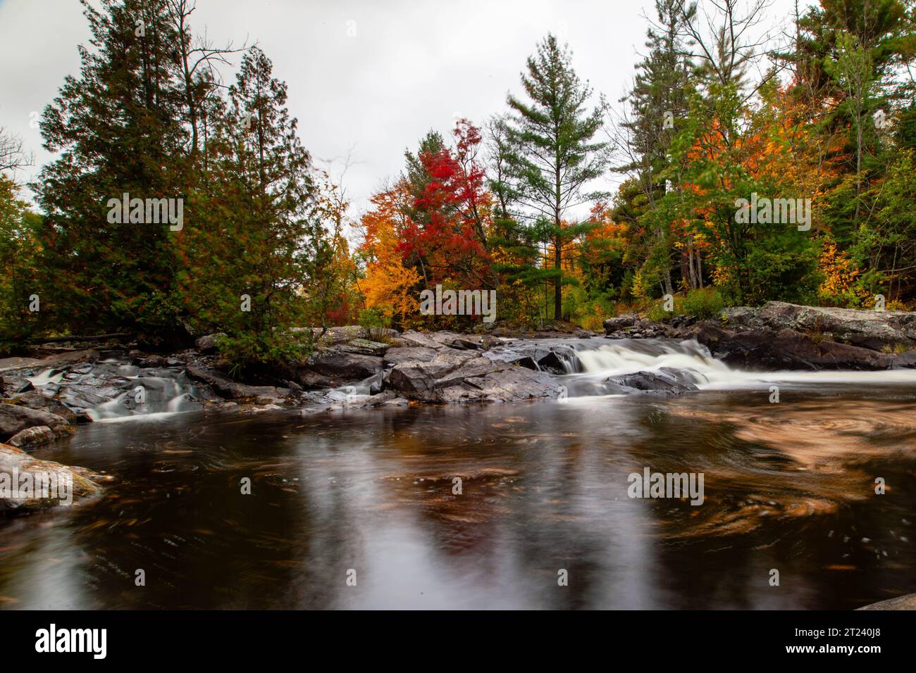 Waterfalls flowing into Lake of the Falls in Mercer, Wisconsin in ...