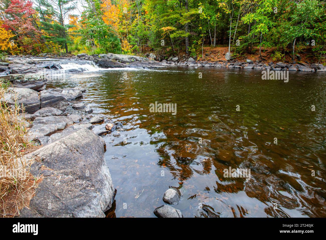 Waterfalls flowing into Lake of the Falls in Mercer, Wisconsin in ...