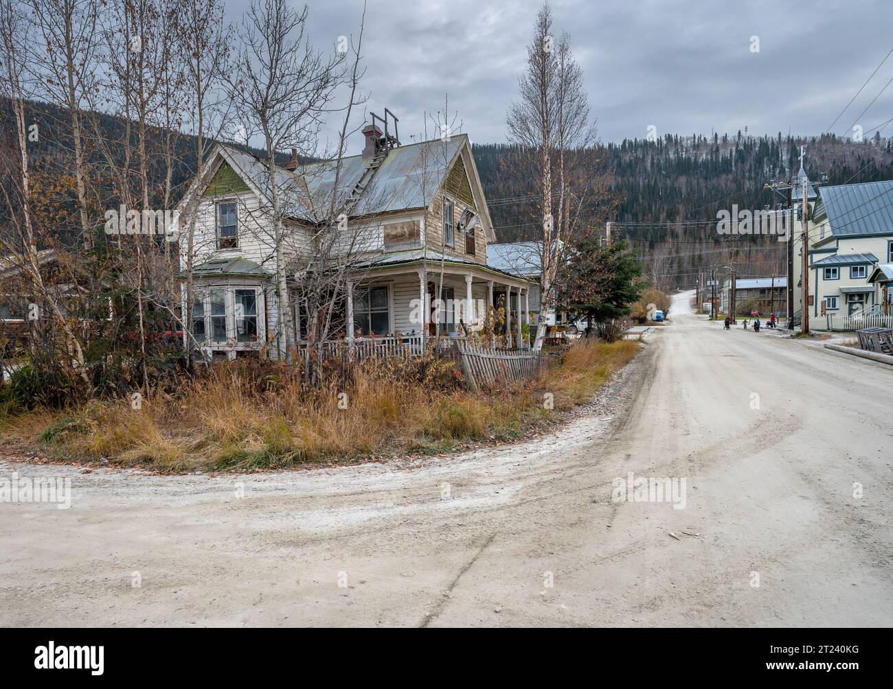 Abandoned historic wooden house on a street in Dawson City, Yukon ...