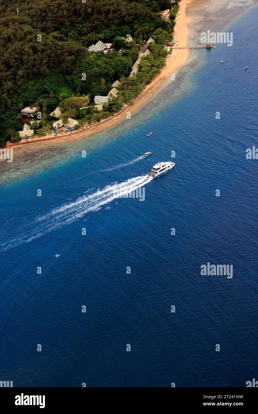cruise ship traveling past fiji resort Stock Photo - Alamy