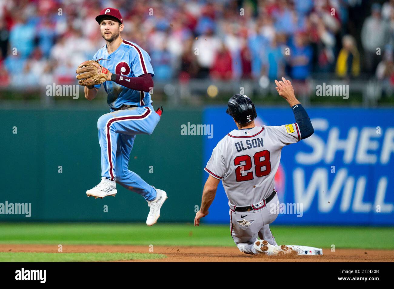 Philadelphia Phillies shortstop Trea Turner, left, turns the double ...