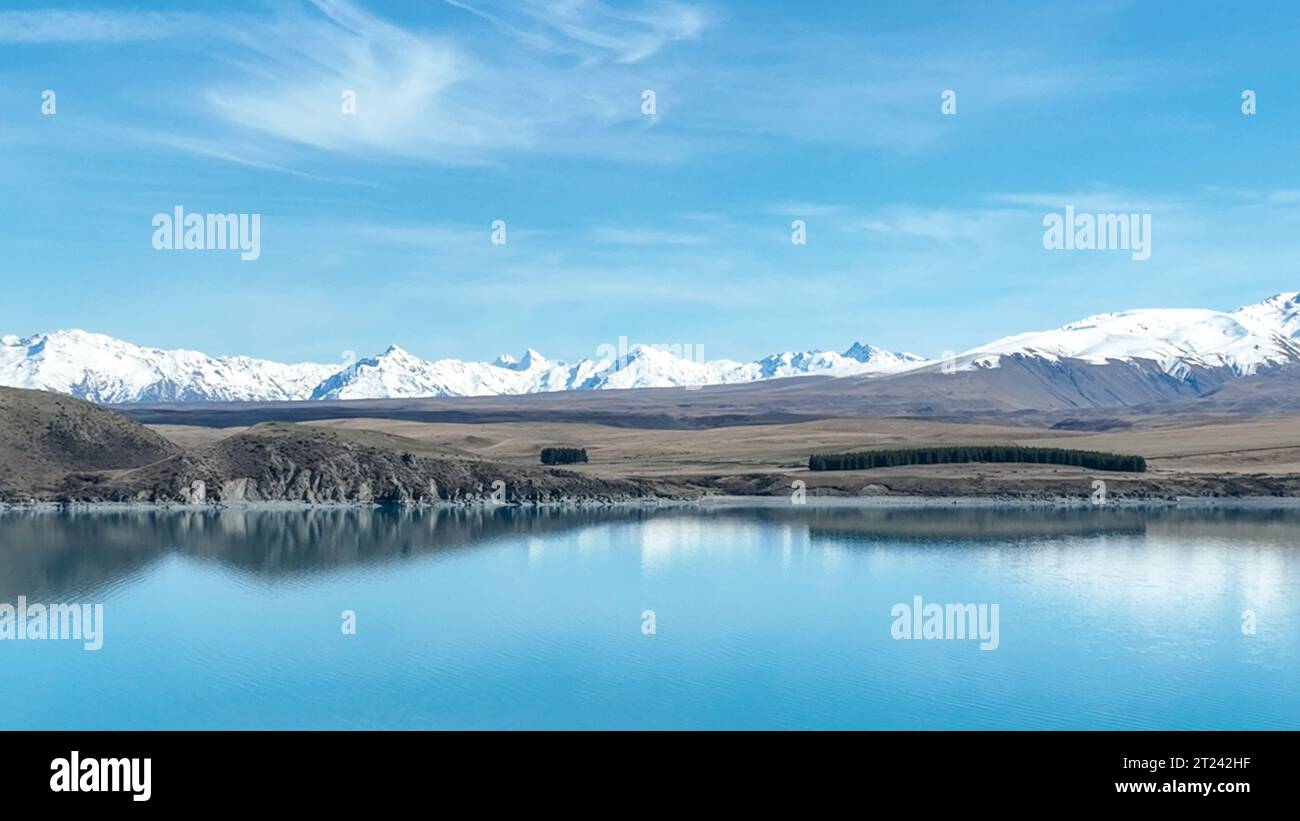 Drone mountain and farming country views of the shores of Lake Tekapo ...