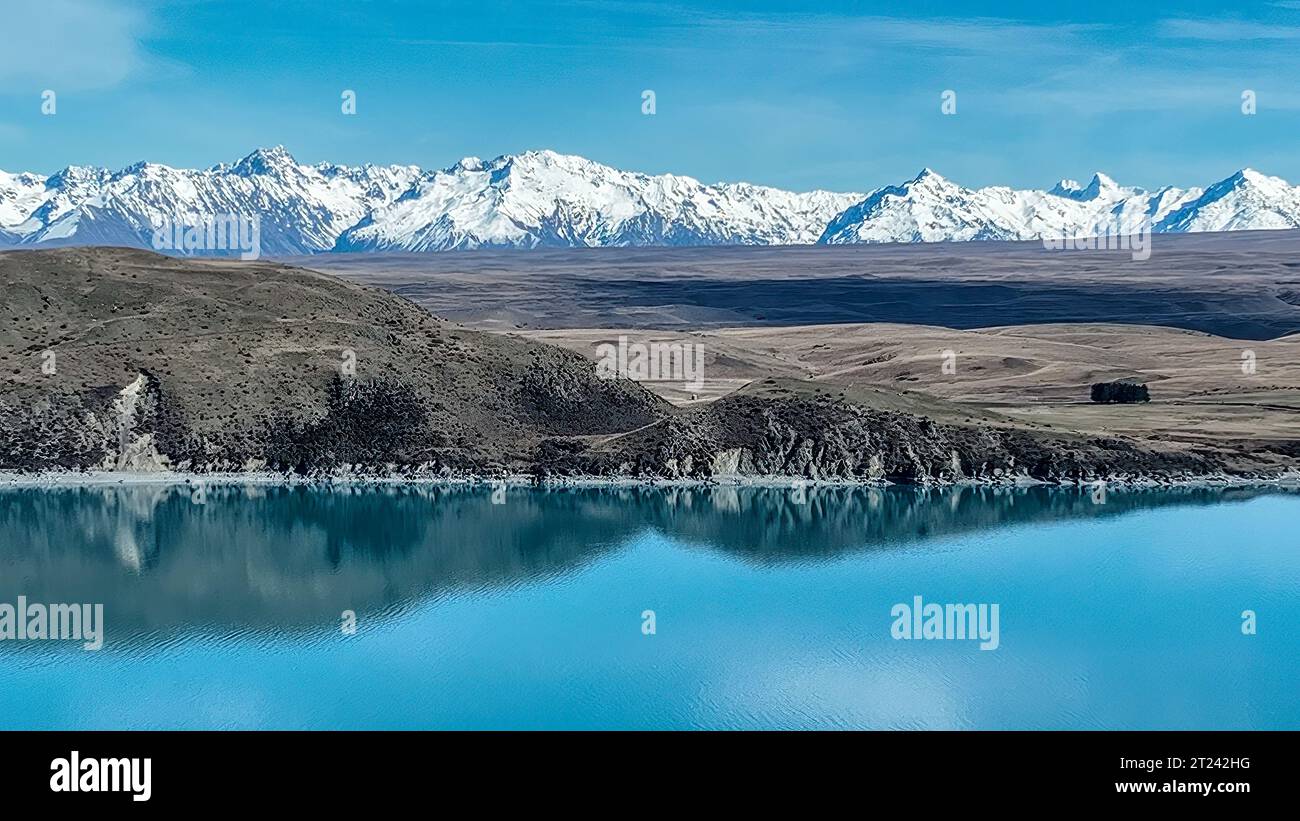Drone mountain and farming country views of the shores of Lake Tekapo ...