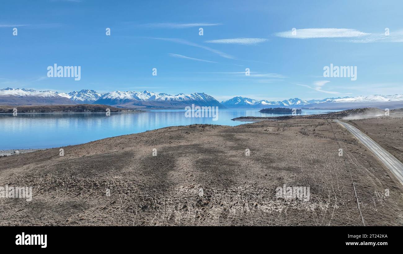 Drone mountain and farming country views of the shores of Lake Tekapo ...