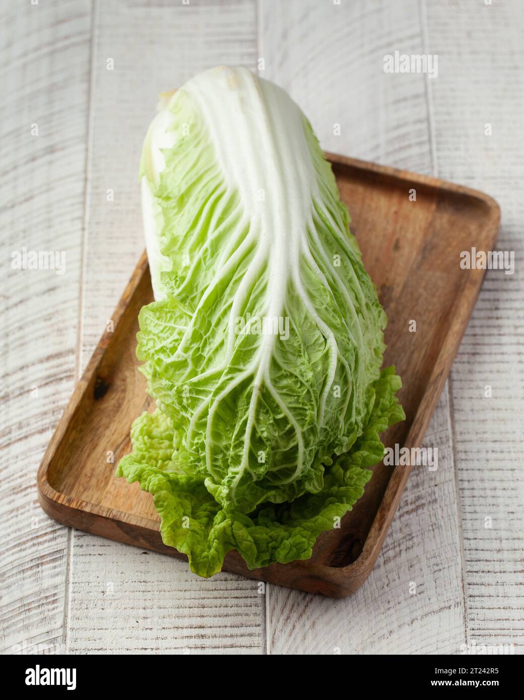 Fresh Chinese cabbage on a white wooden background. Healthy eating ...