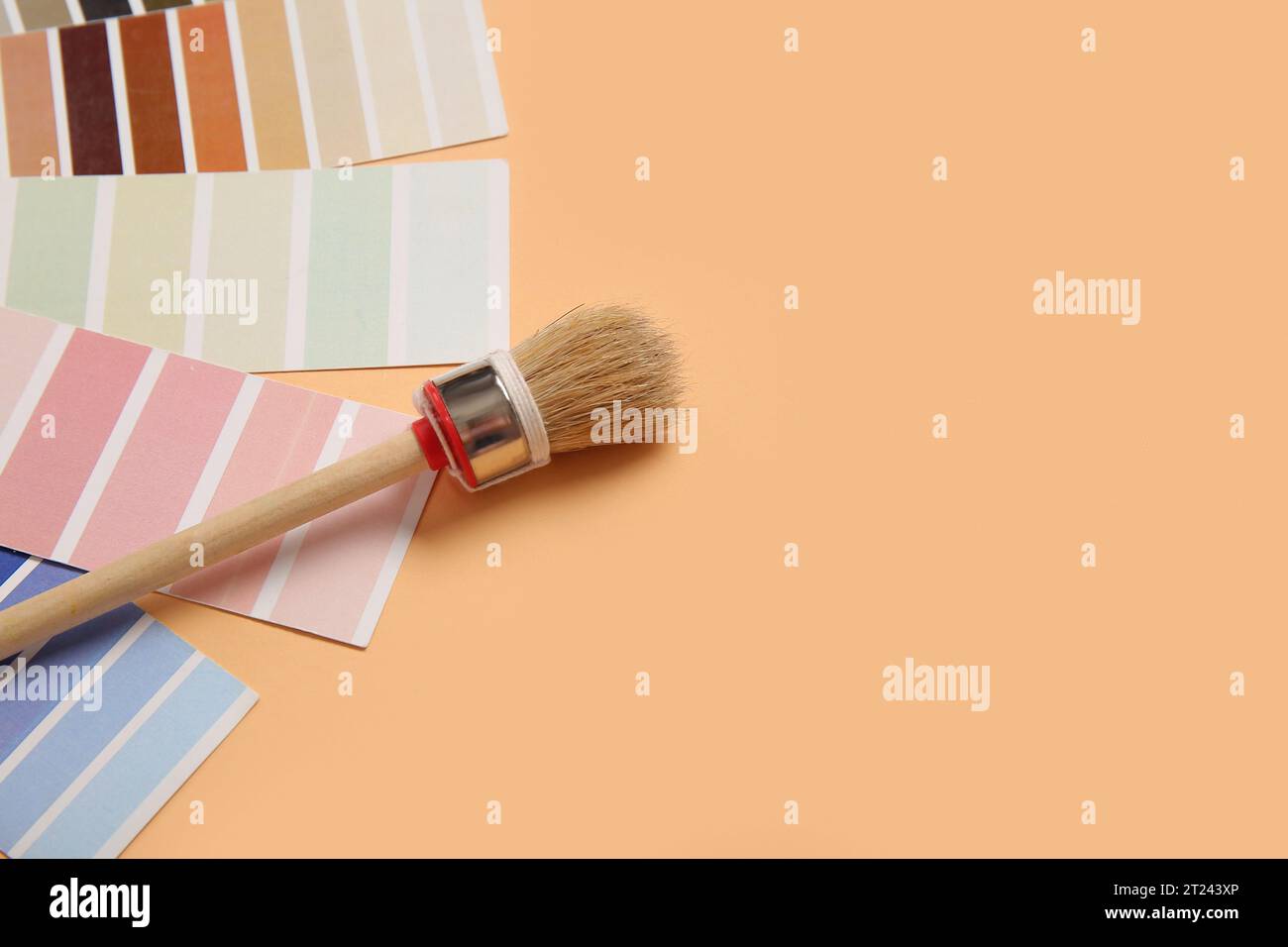 Many color palettes and brush on beige background Stock Photo - Alamy
