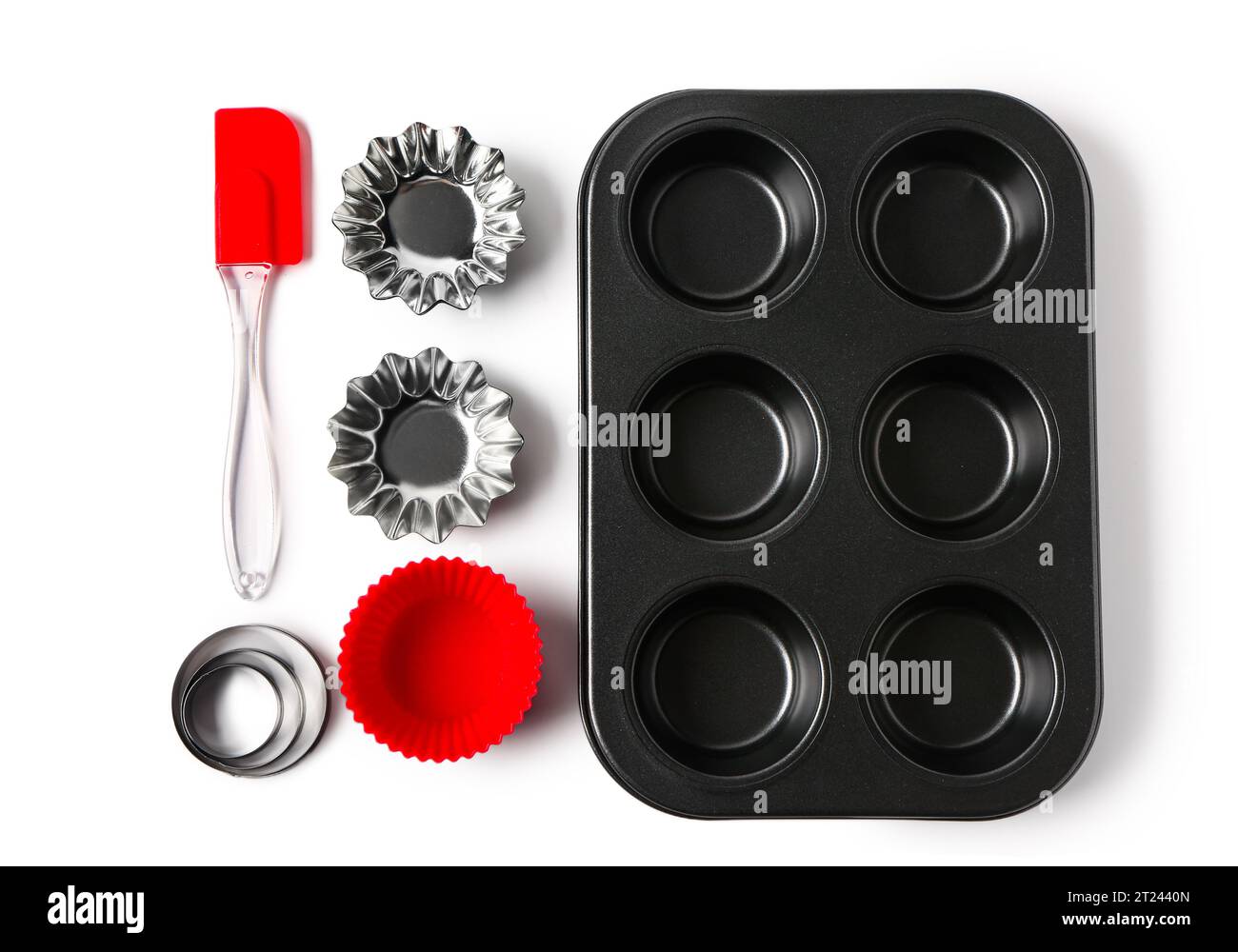 Baking forms and spatula isolated on white background Stock Photo - Alamy