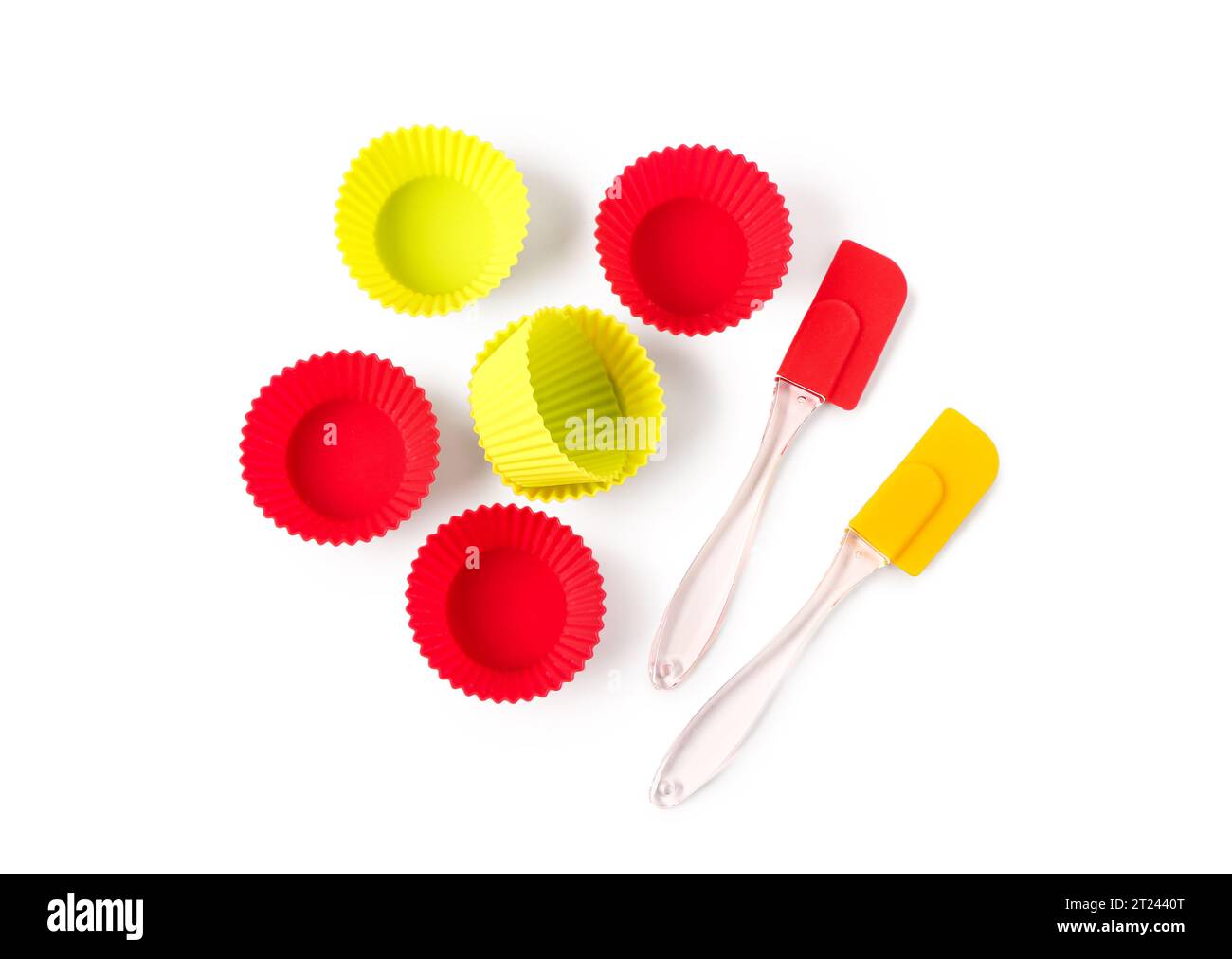 Baking forms and spatulas isolated on white background Stock Photo - Alamy
