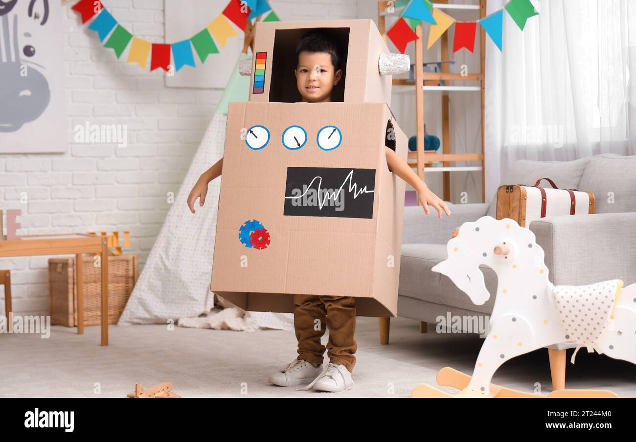 Cute little boy in cardboard robot costume at home Stock Photo - Alamy