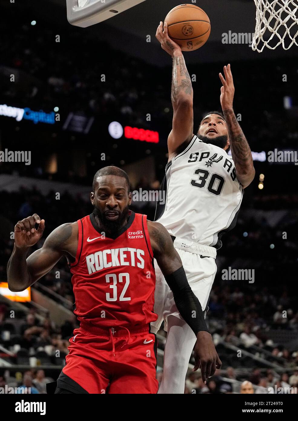 San Antonio Spurs forward Julian Champagnie (30) shoots over Houston ...