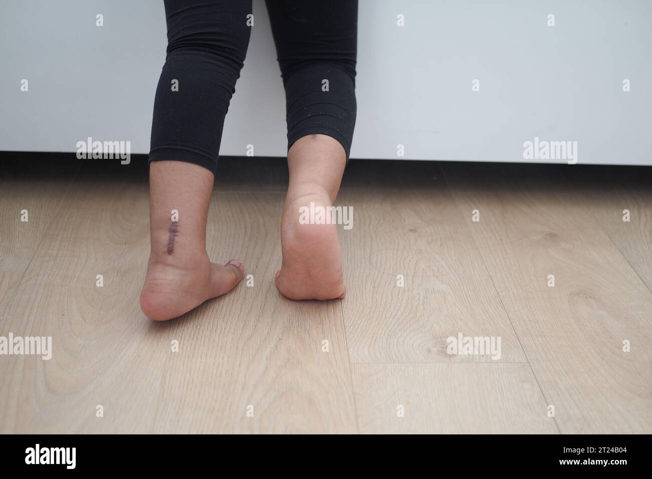 Baby infant walking barefoot on hi-res stock photography and images - Alamy
