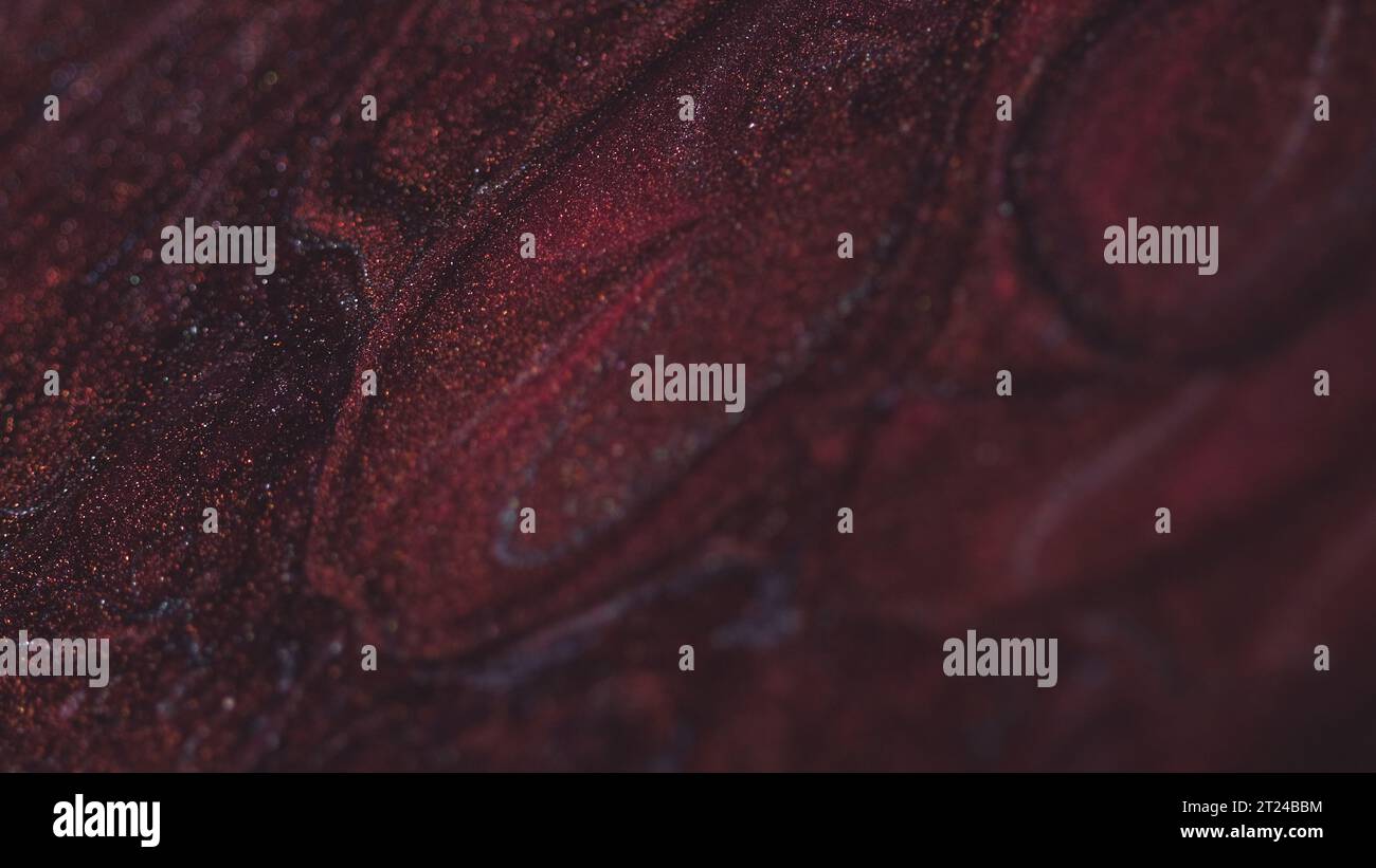 Shimmering fluid background flow burgundy polish Stock Photo - Alamy