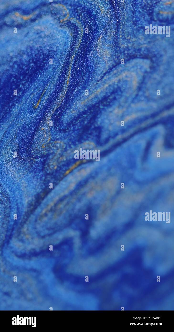 Blue paint wave shimmering sparkling ink Stock Photo - Alamy