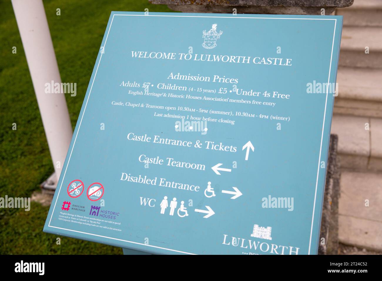 Lulworth castle welcome sign providing details of admission prices and ...