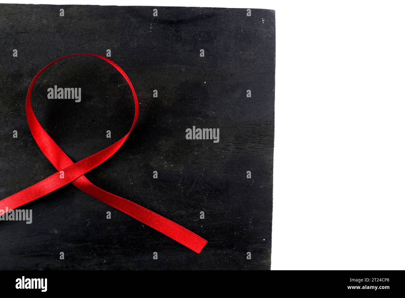 red aids ribbon on old wood background Stock Photo - Alamy