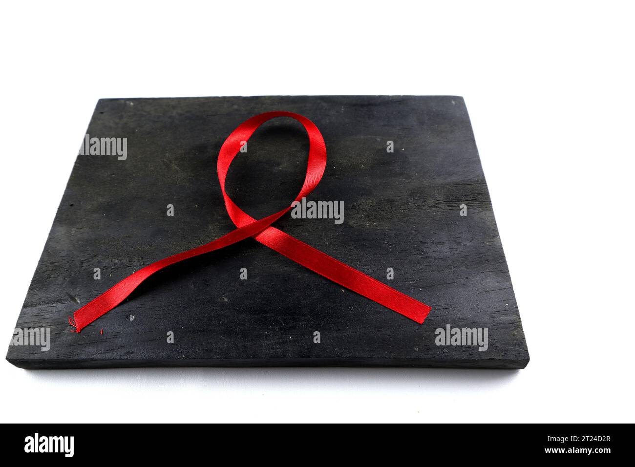 red aids ribbon on old wood background Stock Photo - Alamy