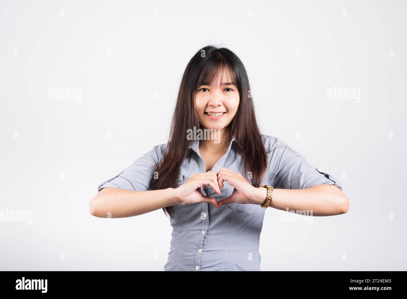 Woman smiling confidence make finger heart gesture figure symbol shape ...
