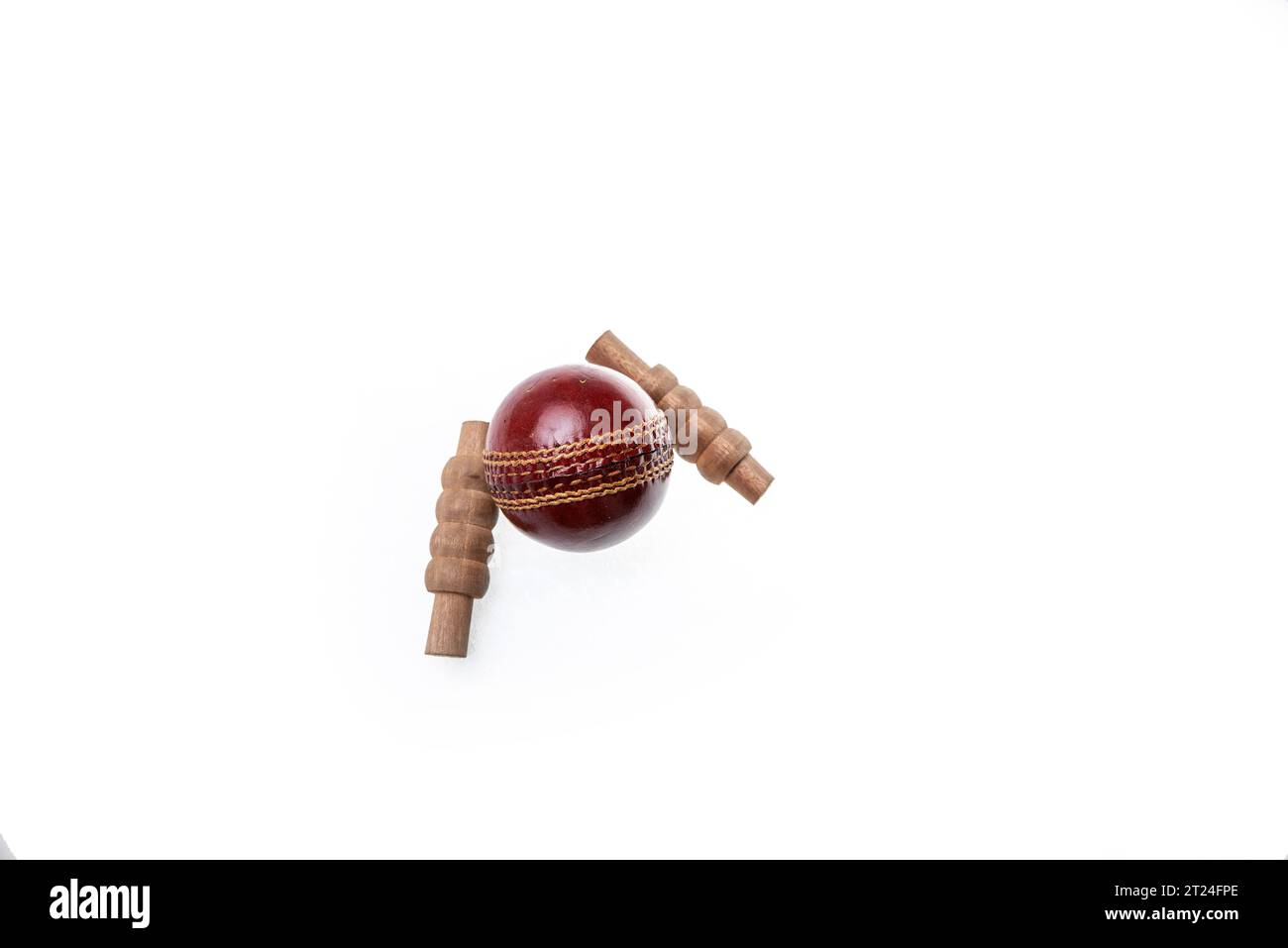 Cricket ball and bails are on isolated white background Stock Photo - Alamy